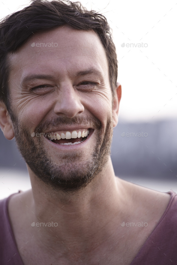 Portrait of laughing man outdoors Stock Photo by westend61 | PhotoDune