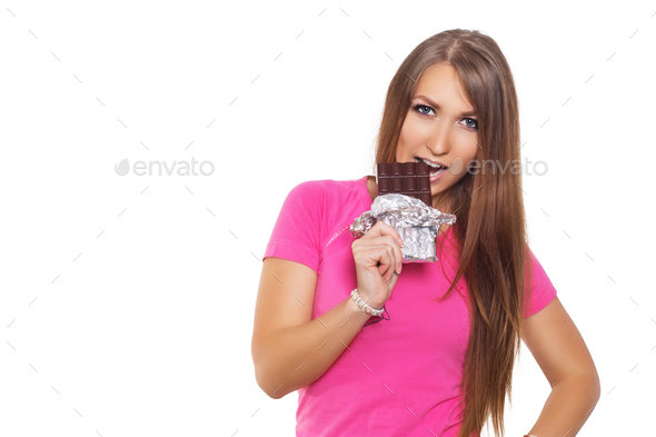 Beauty model woman eating dark chocolate. Beautiful Surprised young ...