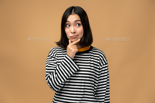 Thoughtful upset girl pondering serious issues, looking with uncertain ...