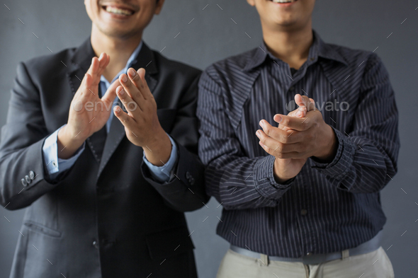 Two businessman clapping Stock Photo by Garakta-Studio | PhotoDune