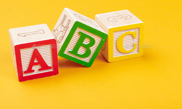Alphabet blocks ABC close up, education concept Stock Photo by FabrikaPhoto