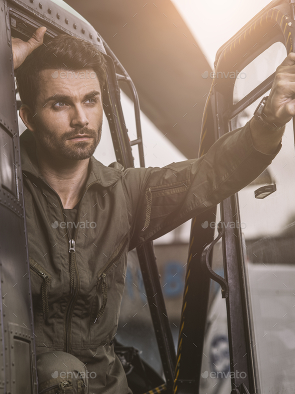 Pilot in a helicopter Stock Photo by westend61 | PhotoDune