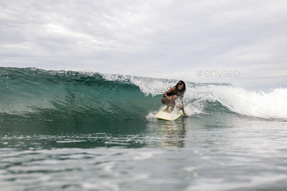 Indonesia, Java, woman surfing Stock Photo by westend61 | PhotoDune