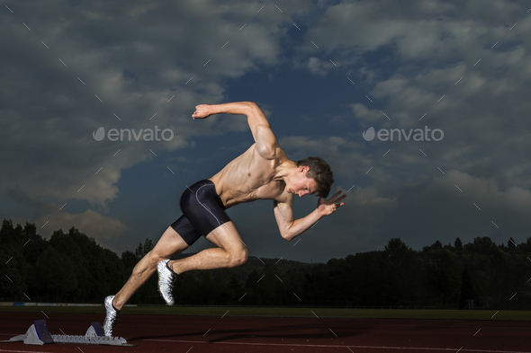 Sprinter starting, side view Stock Photo by westend61 | PhotoDune