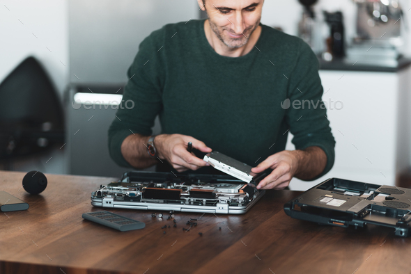 Man repairing laptop Stock Photo by Pasanheco | PhotoDune