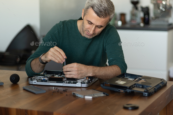Laptop repair. Disassembled computer parts Stock Photo by Pasanheco