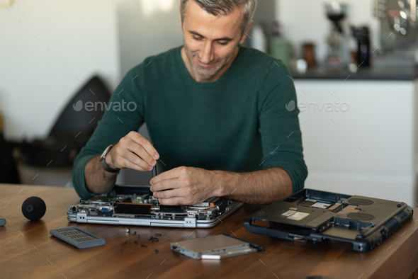 Laptop repair. Disassembled computer parts Stock Photo by Pasanheco