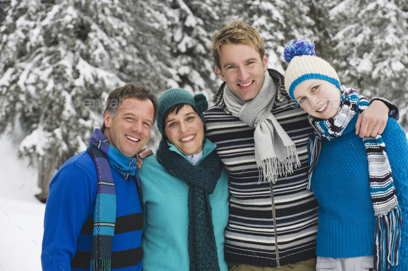 Italy, South Tyrol, Young people in winter clothes, arm in arm ...