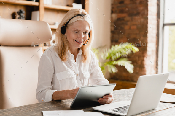 IT support agent, secretary wearing headset while talking helping ...