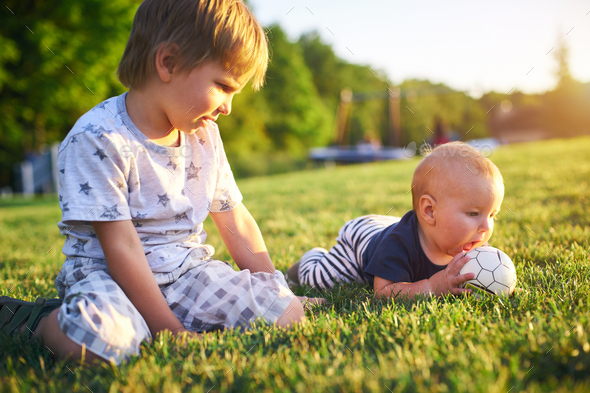 Funny little kids playing with ball Stock Photo by Sandsun | PhotoDune