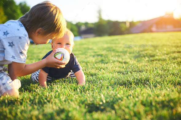 Funny little kids playing with ball Stock Photo by Sandsun | PhotoDune