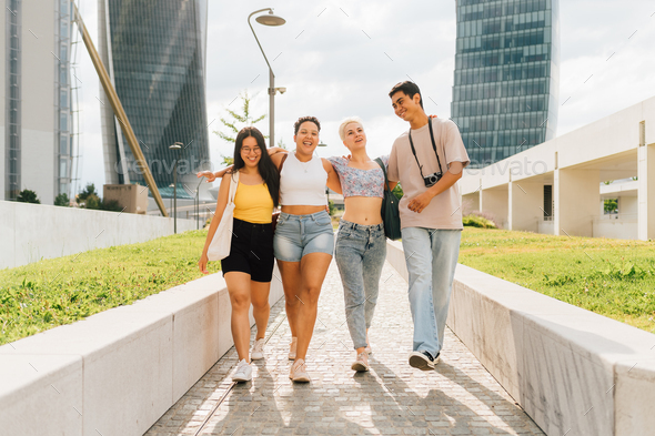 group of multiethnic friends hugging walking outdoor bonding and ...