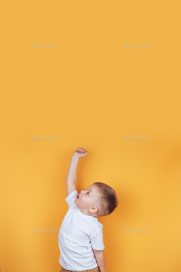 child pointing above him Stock Photo by Nestea06 | PhotoDune