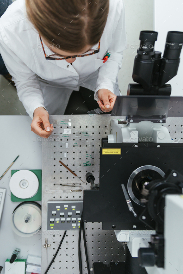 Laboratory technician working in modern lab Stock Photo by westend61