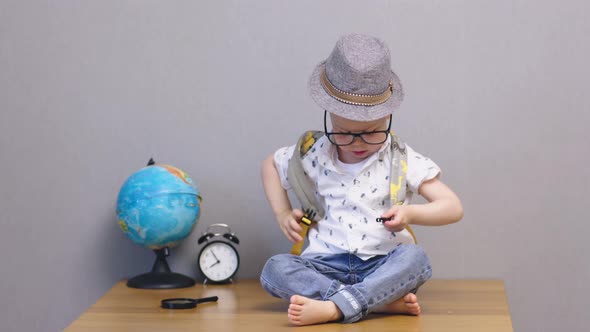 Cute Funny Baby Boy Child Unpacking Schoolbag Taking Off Backpack Come ...