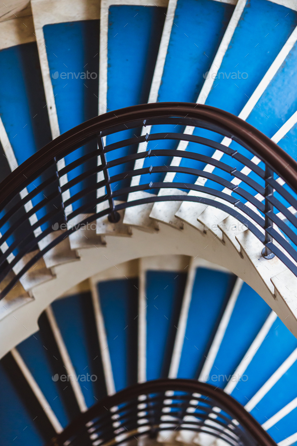 Old blue spiral staircase, spiral stairway inside an old house in ...