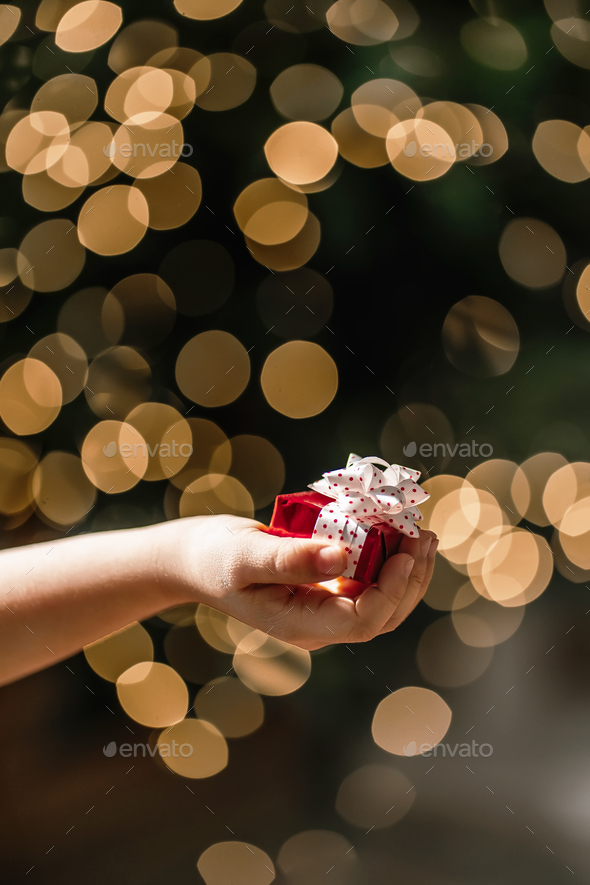 Gifts on the background of a Christmas tree with a bokeh. Stock Photo ...