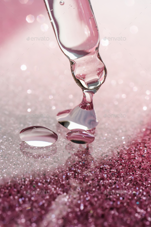 Cosmetic pipette with a pink on dark background. Stock Photo by ...