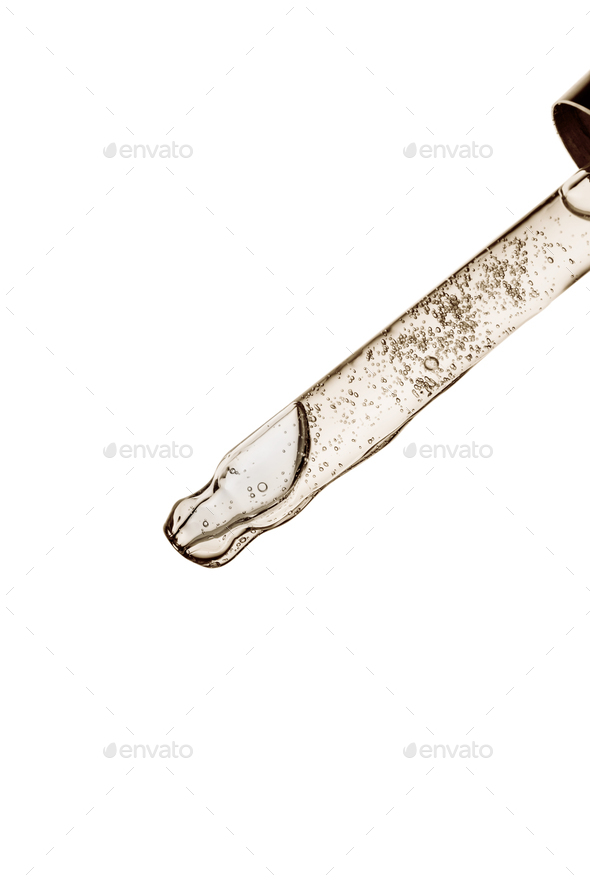 Transparent pipette with cosmetics on a light background. Stock Photo ...