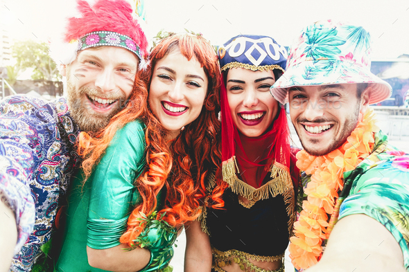 Crazy dressed people doing selfie and celebrating at carnival party ...