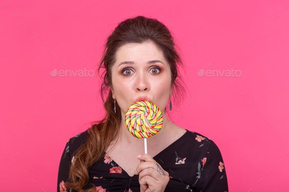 Candy, addiction to sweet and emotions concept - surprised woman with ...