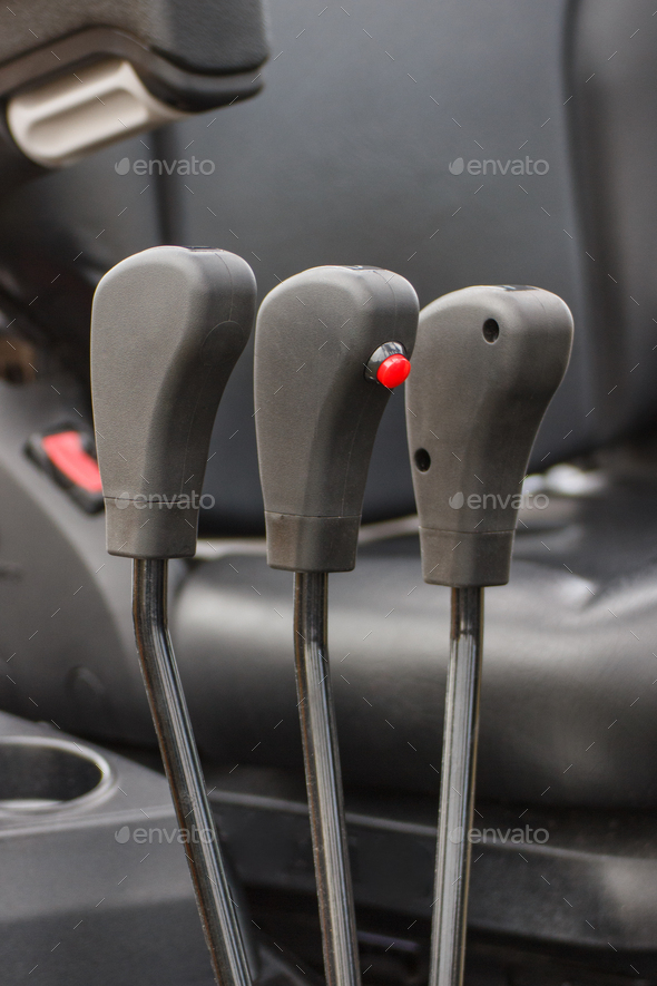 Operating control levers with buttons in forklift or other industrial ...