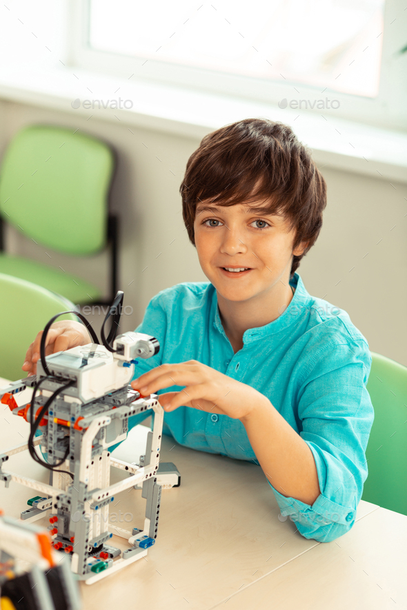 Cheerful boy during his engineering lesson at school Stock Photo by ...