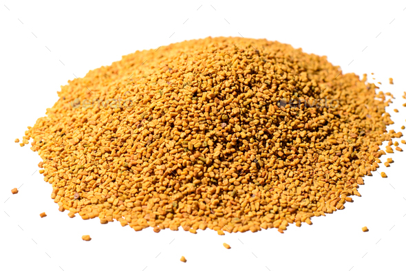 Heap of yellow Egyptian Helba tea isolated on white background, side ...