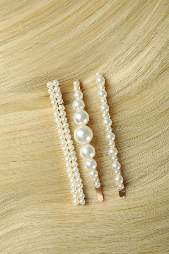 Female hair with hair clips on whole background Stock Photo by ...