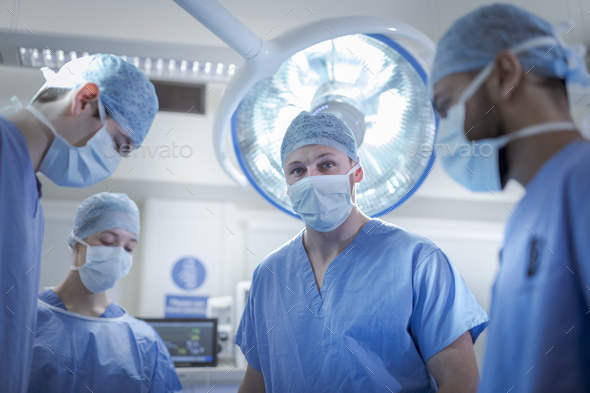 Staff in operating theatre Stock Photo by Image-Source | PhotoDune