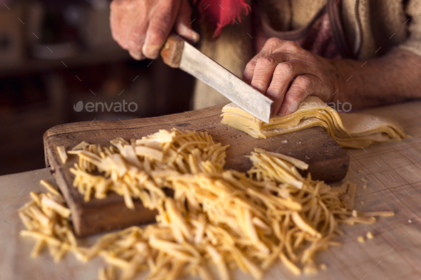 Cutting pasta Stock Photo by vladans | PhotoDune