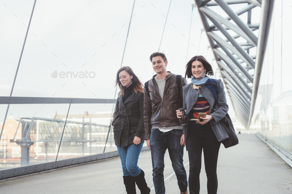 three people walking outdoor having fun Stock Photo by peus80 | PhotoDune