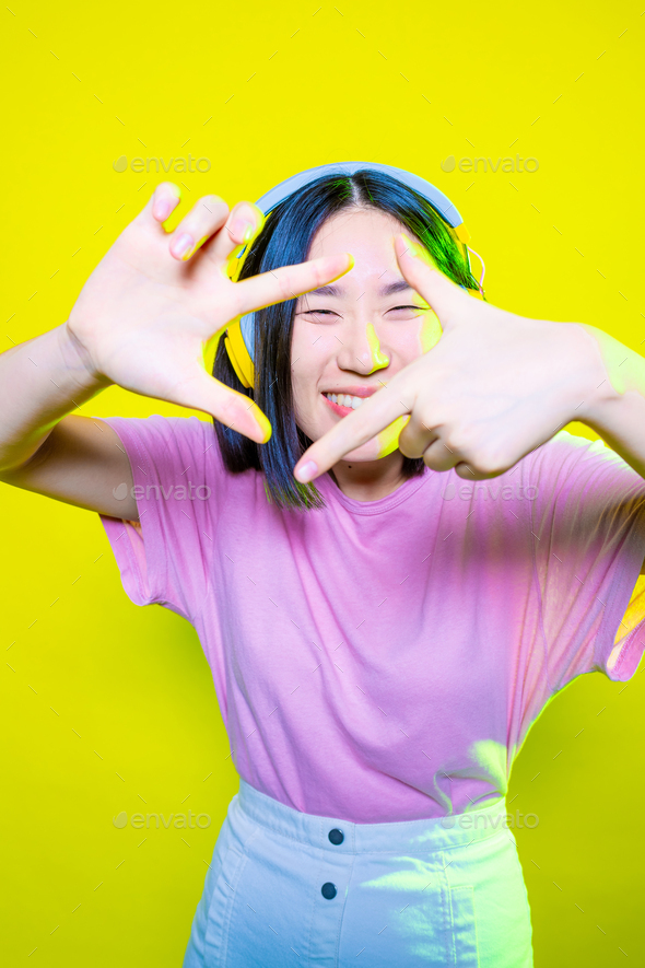 Young asian woman making frame fingers isolated background Stock Photo ...
