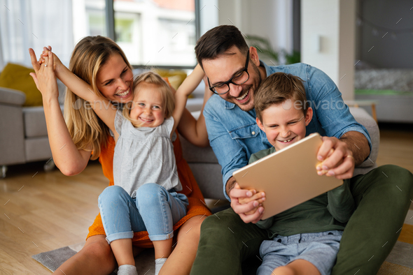 Device technology family online education concept. Happy family with ...