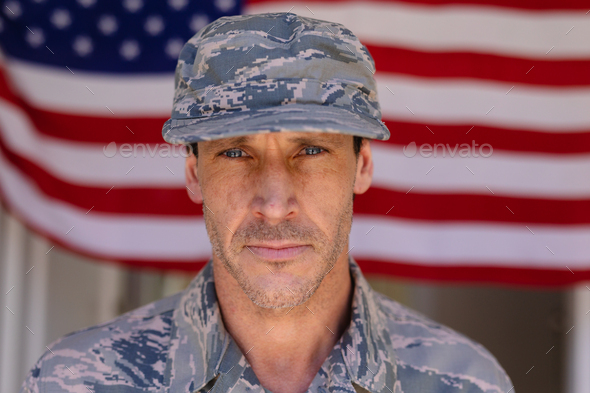 Portrait of caucasian military soldier wearing cap and camouflage ...