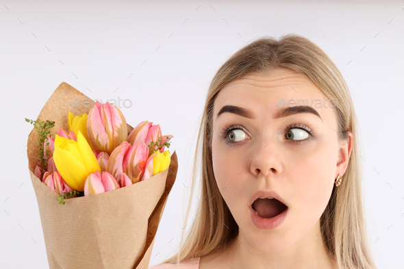 Excited girl with bouquet of flowers on white background Stock Photo by ...