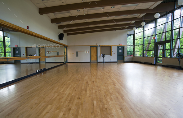 A dance ballet studio,with a sprung wooden floor, barre and wall ...