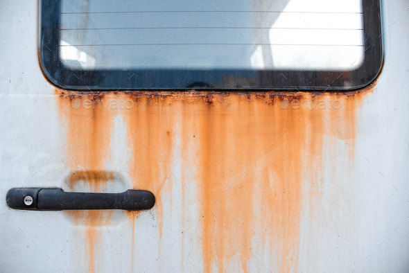 Rust on the back door of trucks. Rusty smudges at the car window Stock ...