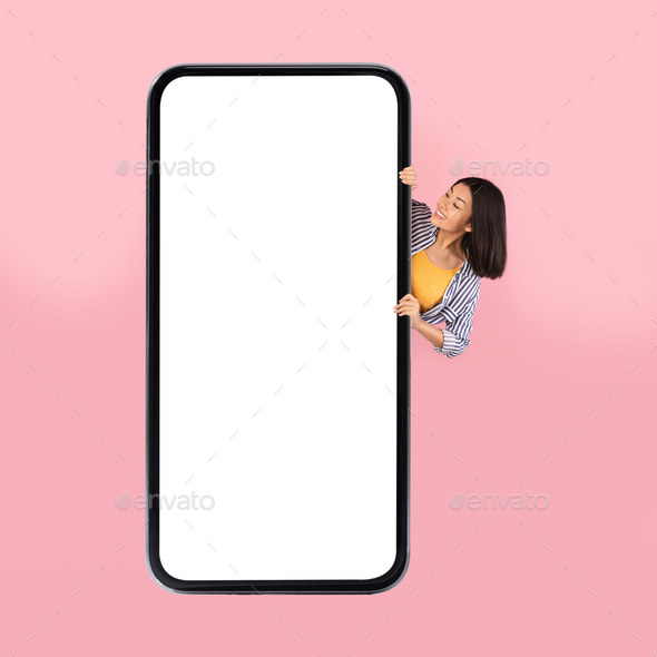 Asian Female Hiding Behind Big Cellphone Screen Over Pink Background ...