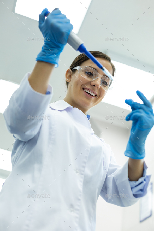 Positive delighted female person working in laboratory Stock Photo by ...