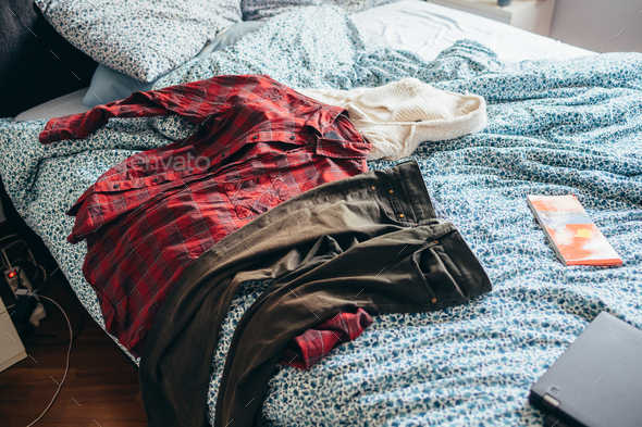 Room with messy clothes scatter on the bed Stock Photo by peus80 ...