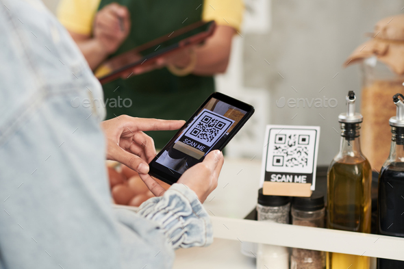 Customer Scanning QR-code on Counter Stock Photo by DragonImages ...