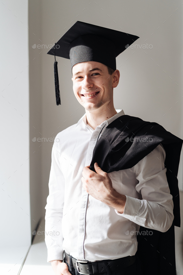 Caucasian young man feeling very excited to receive his bachelors ...