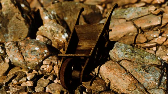 Abandoned Wooden Mine Wheelbarrow on Rocks, Motion Graphics | VideoHive