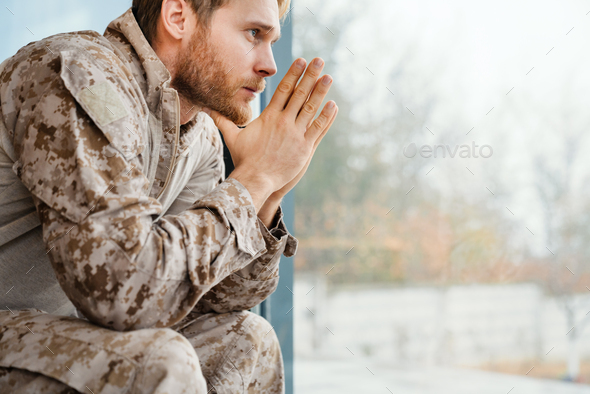 Masculine confident military man in uniform sitting and thinking Stock ...