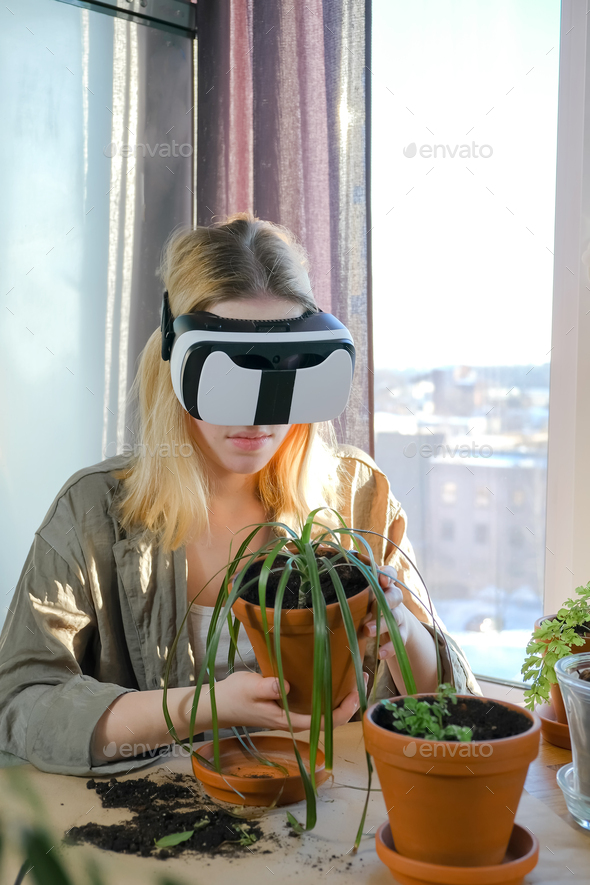 Gardening.Virtual world, metaverse.Girl planting flowers in immersive ...