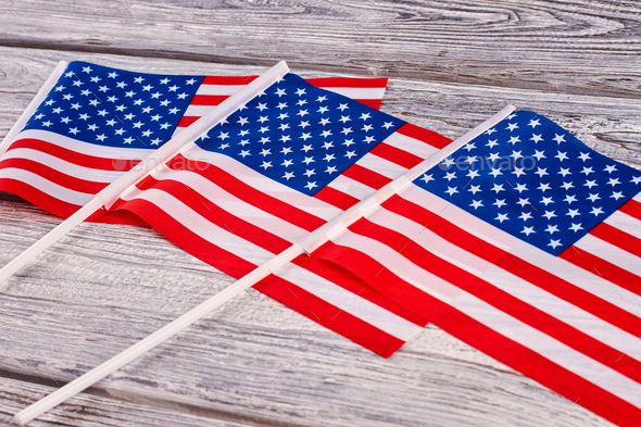 Three cocktail flags of USA on wooden background. Stock Photo by ...