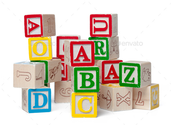 Colorful alphabet blocks stacked in a mess isolated on white background ...