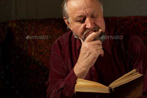 Wise man behind reading by the book Stock Photo by AboutImages | PhotoDune