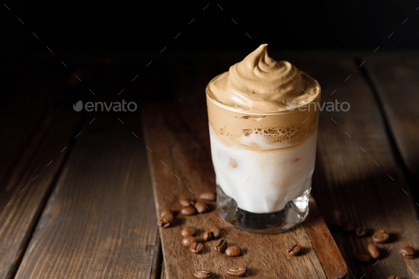 Dalgona coffee - the Korean coffee drink on wooden background. Stock ...